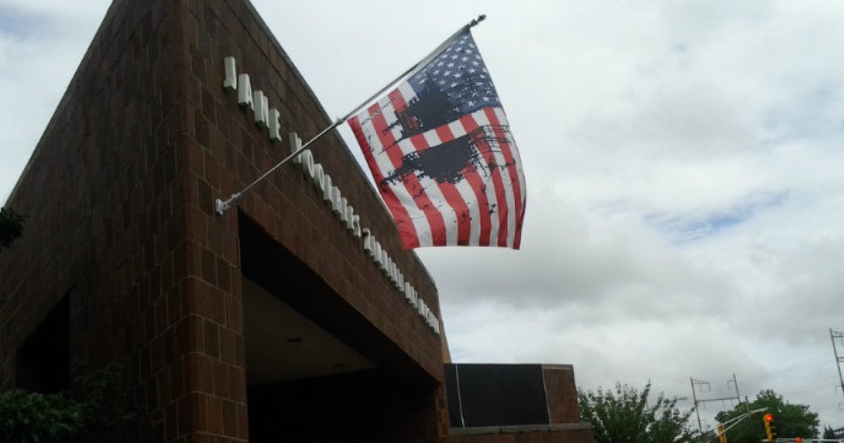Rutgers restores flag artwork display after temporarily moving it indoors